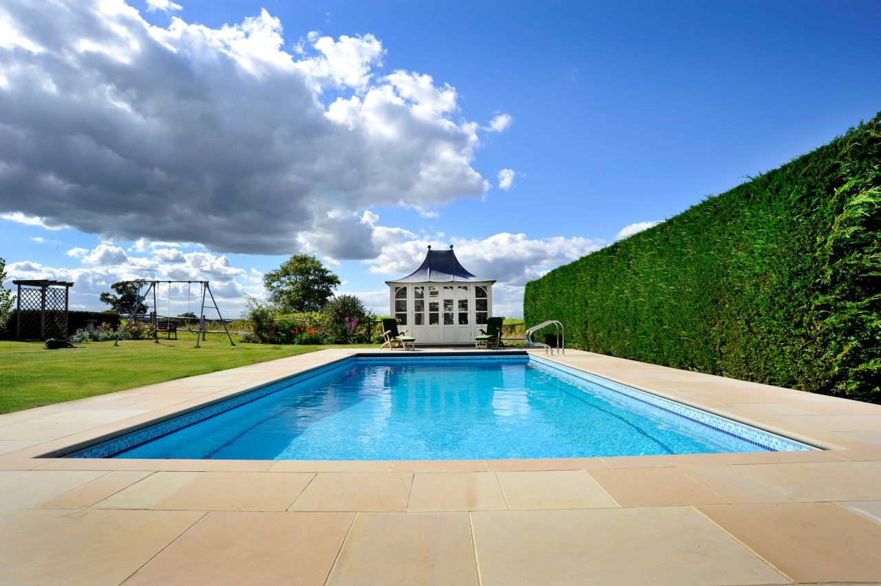 Danebury sawn sandstone pool coping and matching paving pool terrace ...