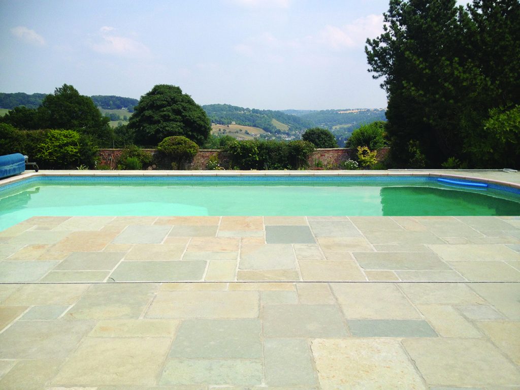 Downton Antiqued tumbled limestone paving and pool surround by ...
